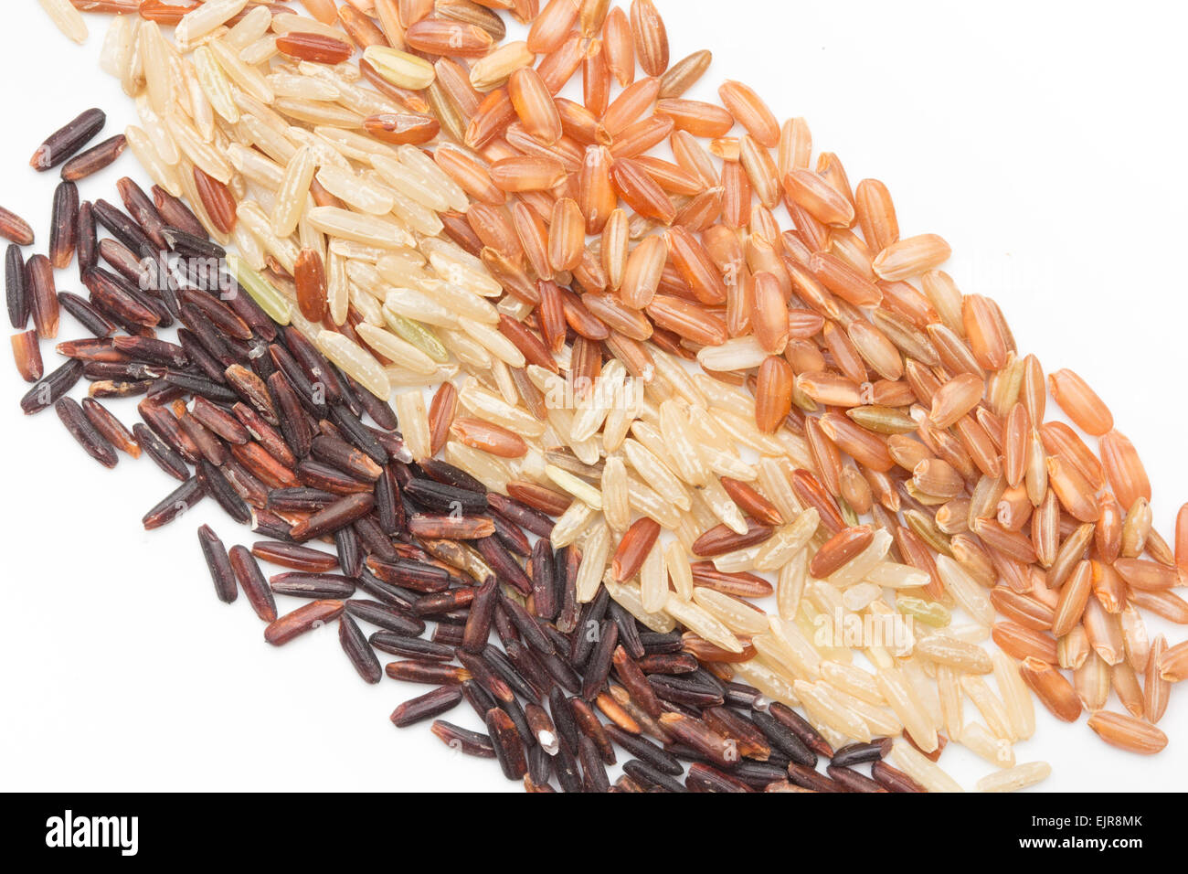 rice on a pile isolated on white background Stock Photo - Alamy
