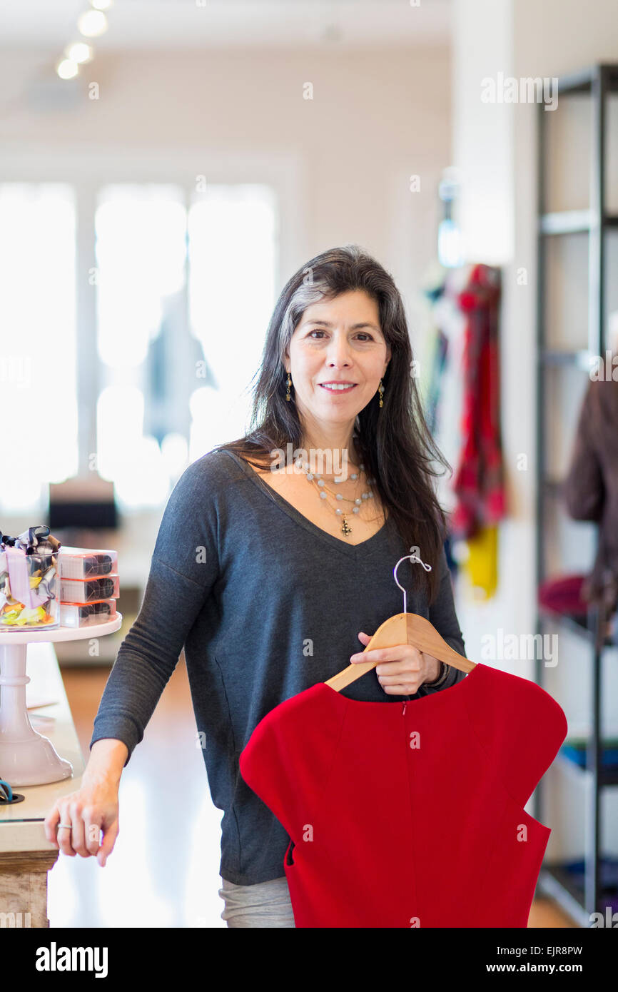 Hispanic small business owner working in store Stock Photo - Alamy