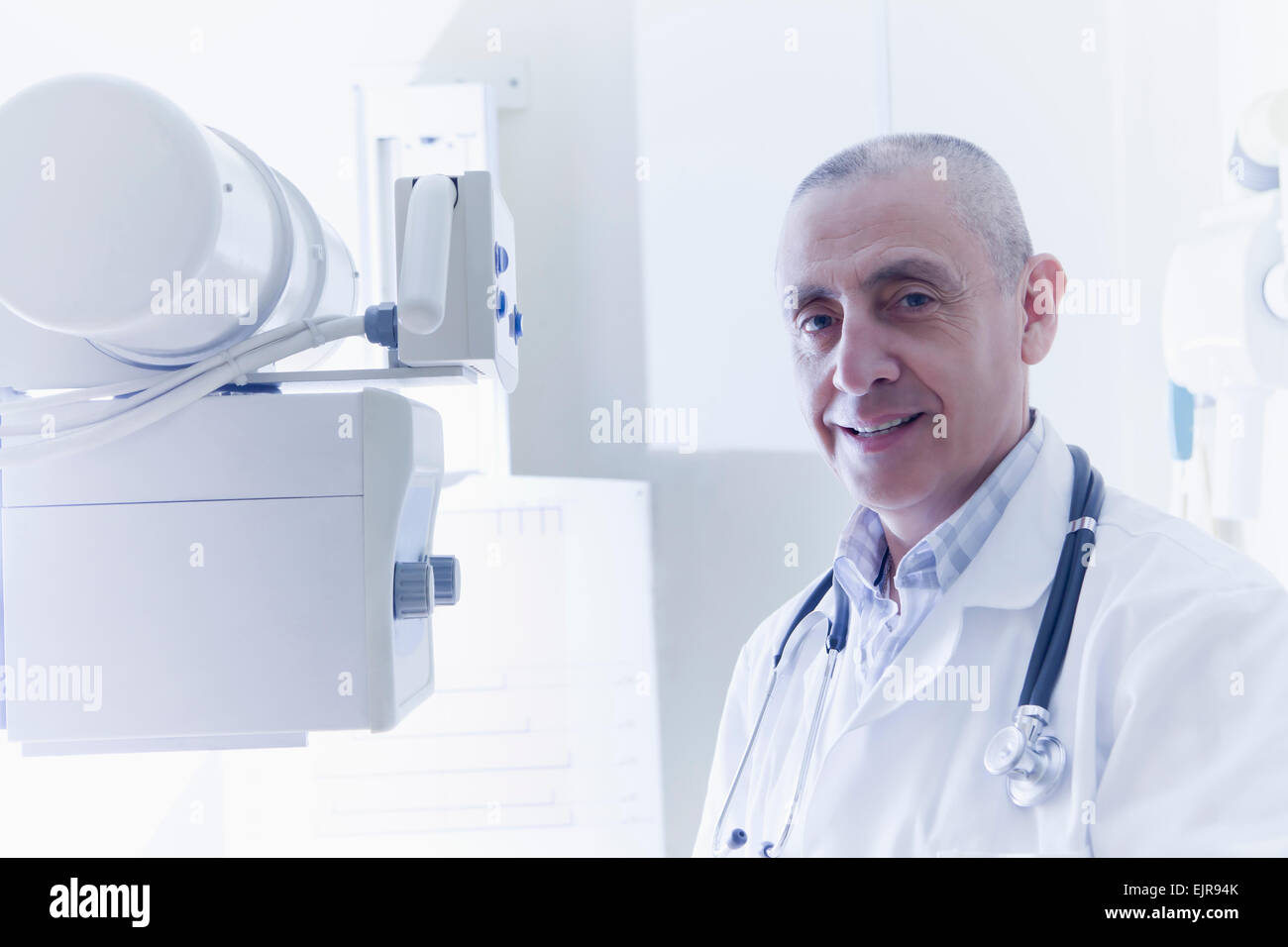 Hispanic doctor smiling in hospital Stock Photo - Alamy