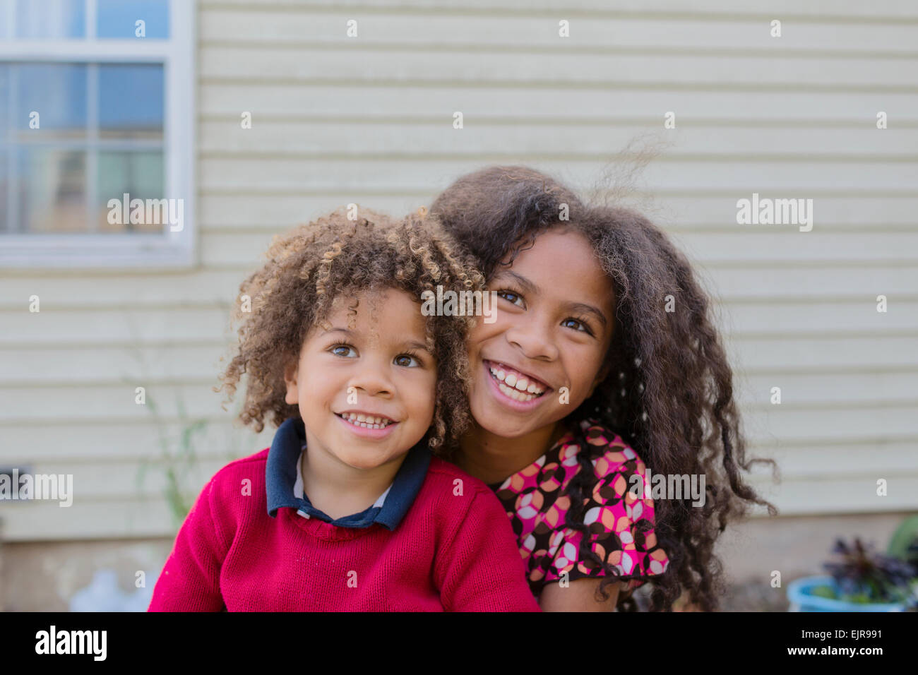 Pacific Islander brother and sister hugging outdoors Stock Photo - Alamy