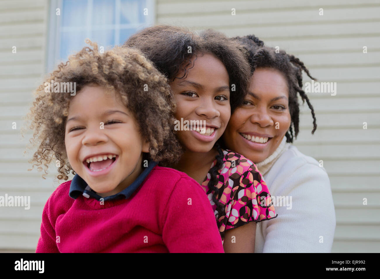 Pacific Islander mother and children hugging outdoors Stock Photo - Alamy