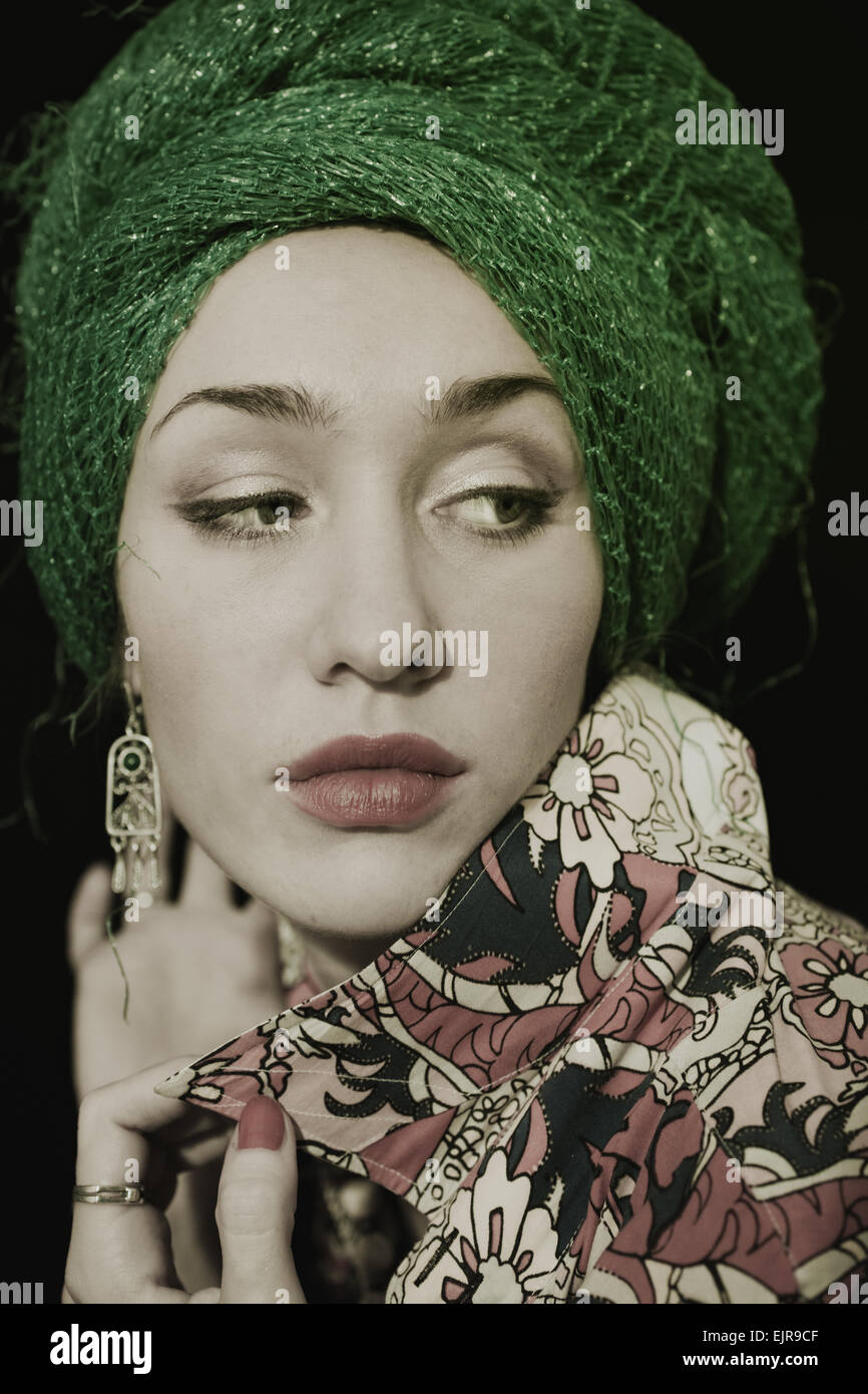 portrait of a beautiful young woman wearing a woman's headdress Stock ...