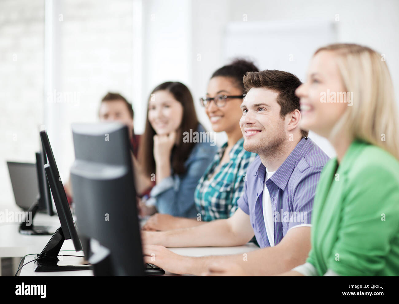 students with computers studying at school Stock Photo - Alamy