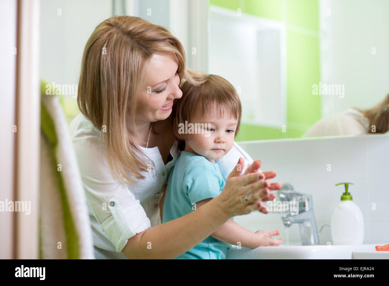 Boy washing hands hi-res stock photography and images - Alamy
