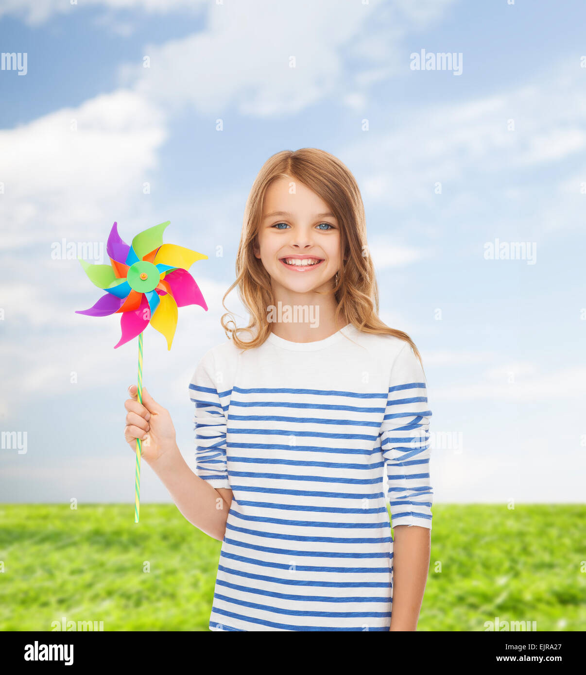 smiling child with colorful windmill toy Stock Photo - Alamy