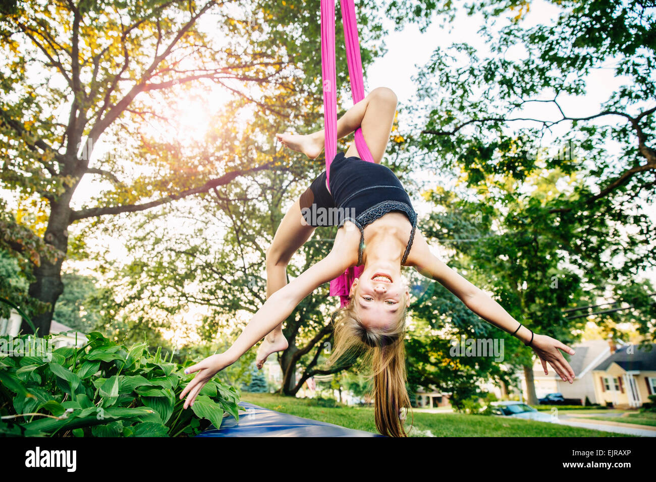 Girls hanging upside down hi-res stock photography and images - Alamy