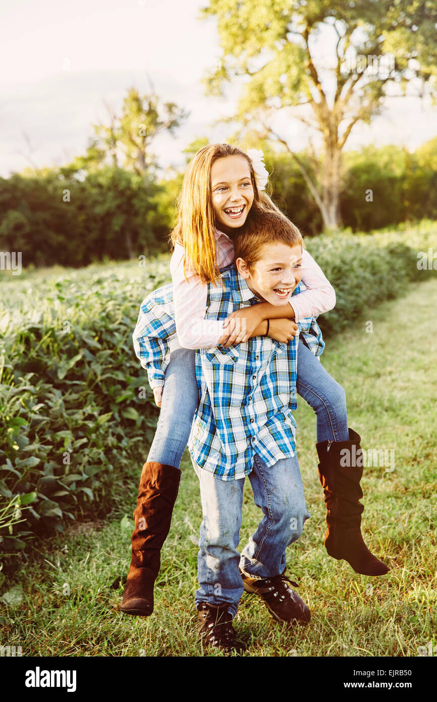 Caucasian children playing in crop field on farm Stock Photo - Alamy