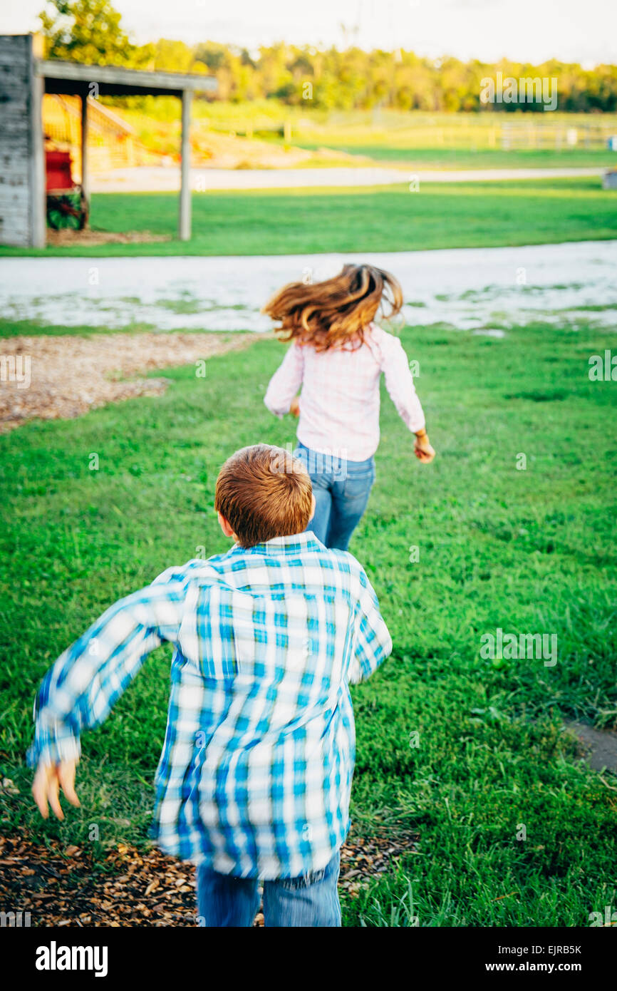 Caucasian children playing on farm Stock Photo - Alamy