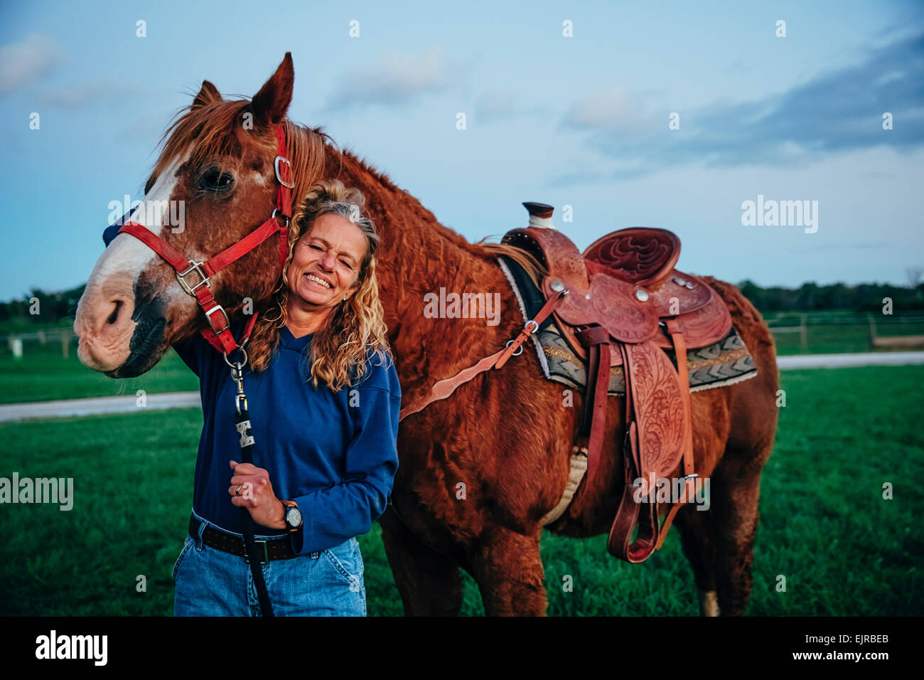 Middle aged woman horse riding hi-res stock photography and images - Alamy