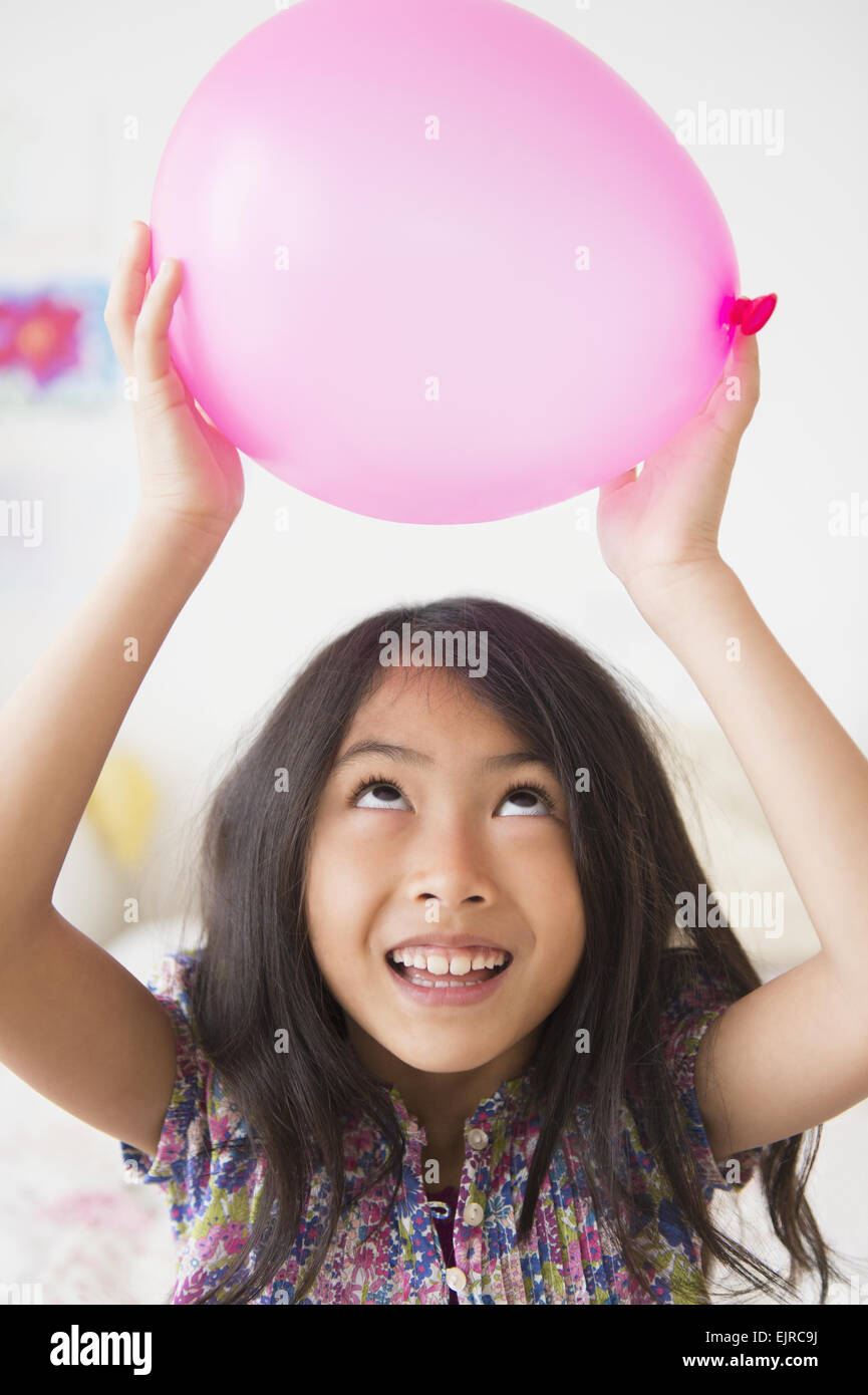 Vietnamese girl holding pink balloon Stock Photo - Alamy