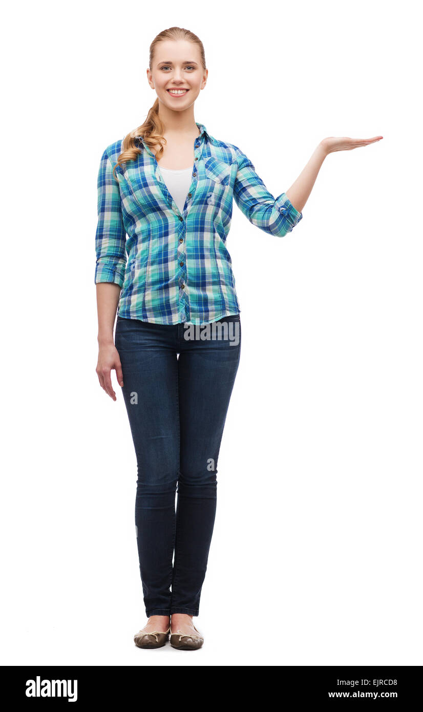 smiling young woman holding something on hand Stock Photo - Alamy