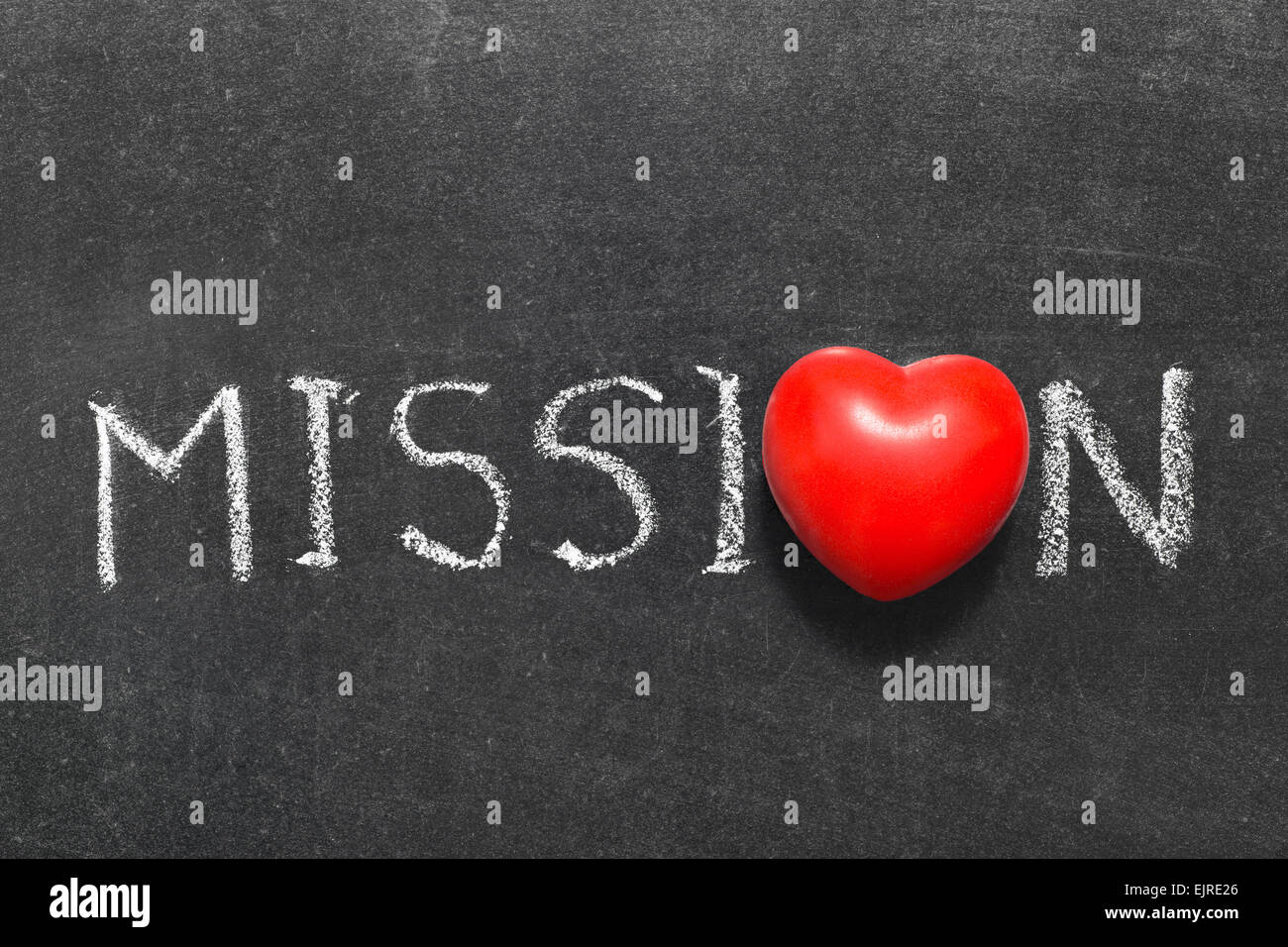 mission word handwritten on blackboard with heart symbol instead of O ...