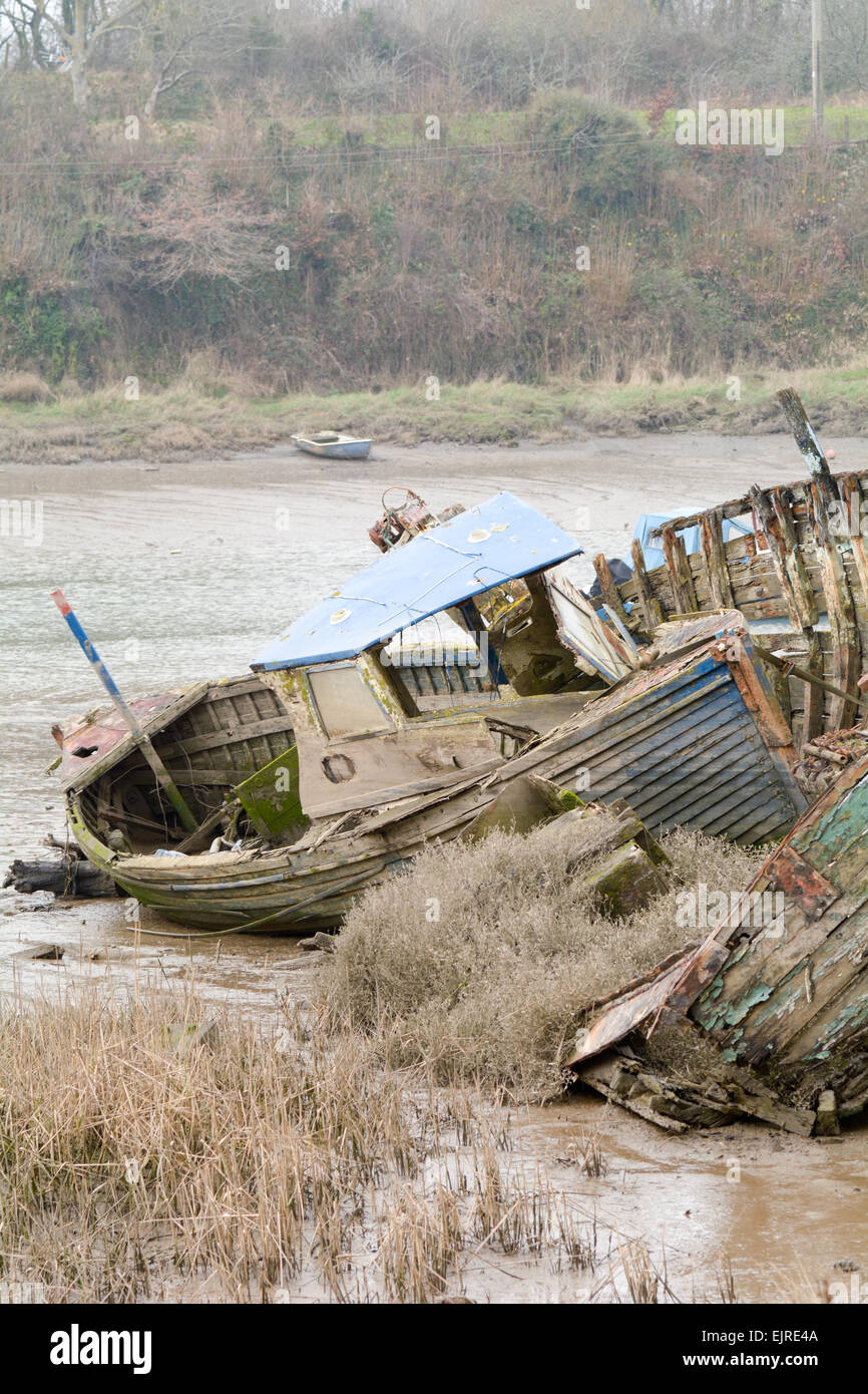 Two old damaged rotting boats left to decay on River Taw, Fremington ...