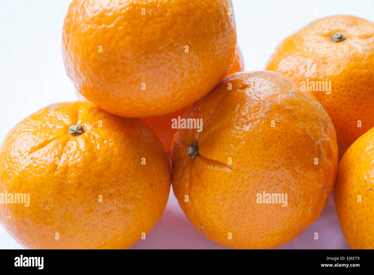 a group of fresh oranges on a clean white background Stock Photo - Alamy
