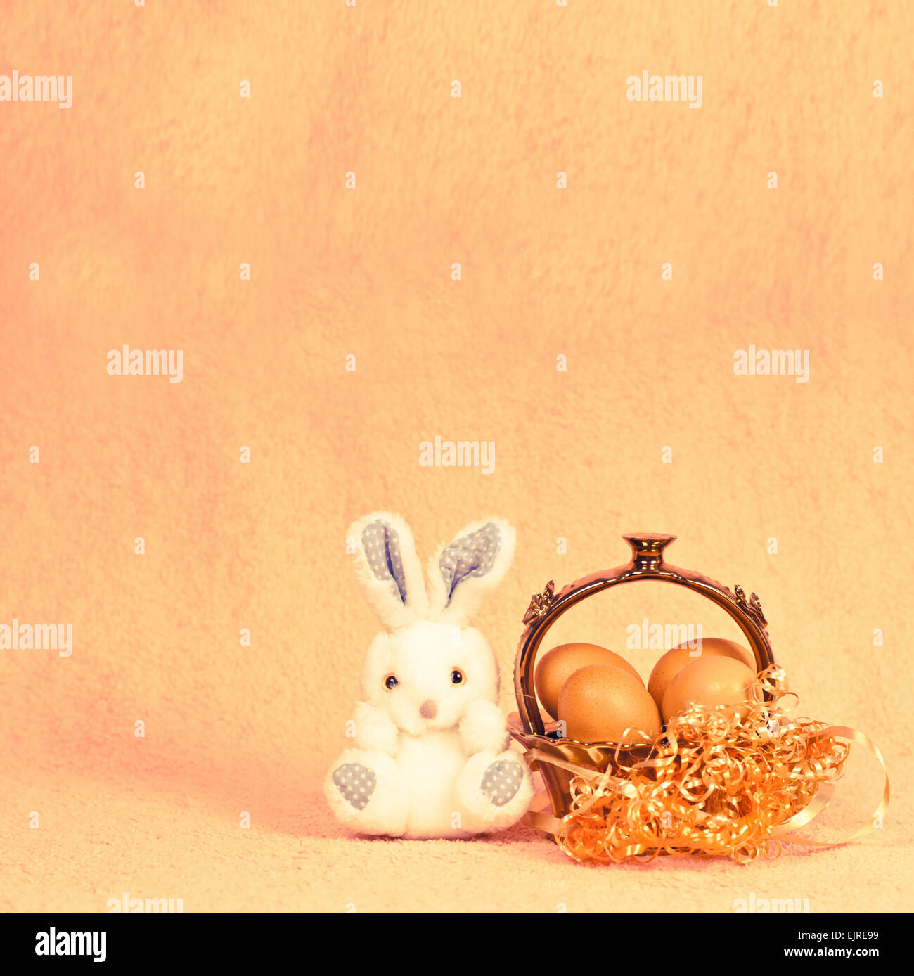 Retro photo effect Easter rabbit with eggs Stock Photo - Alamy