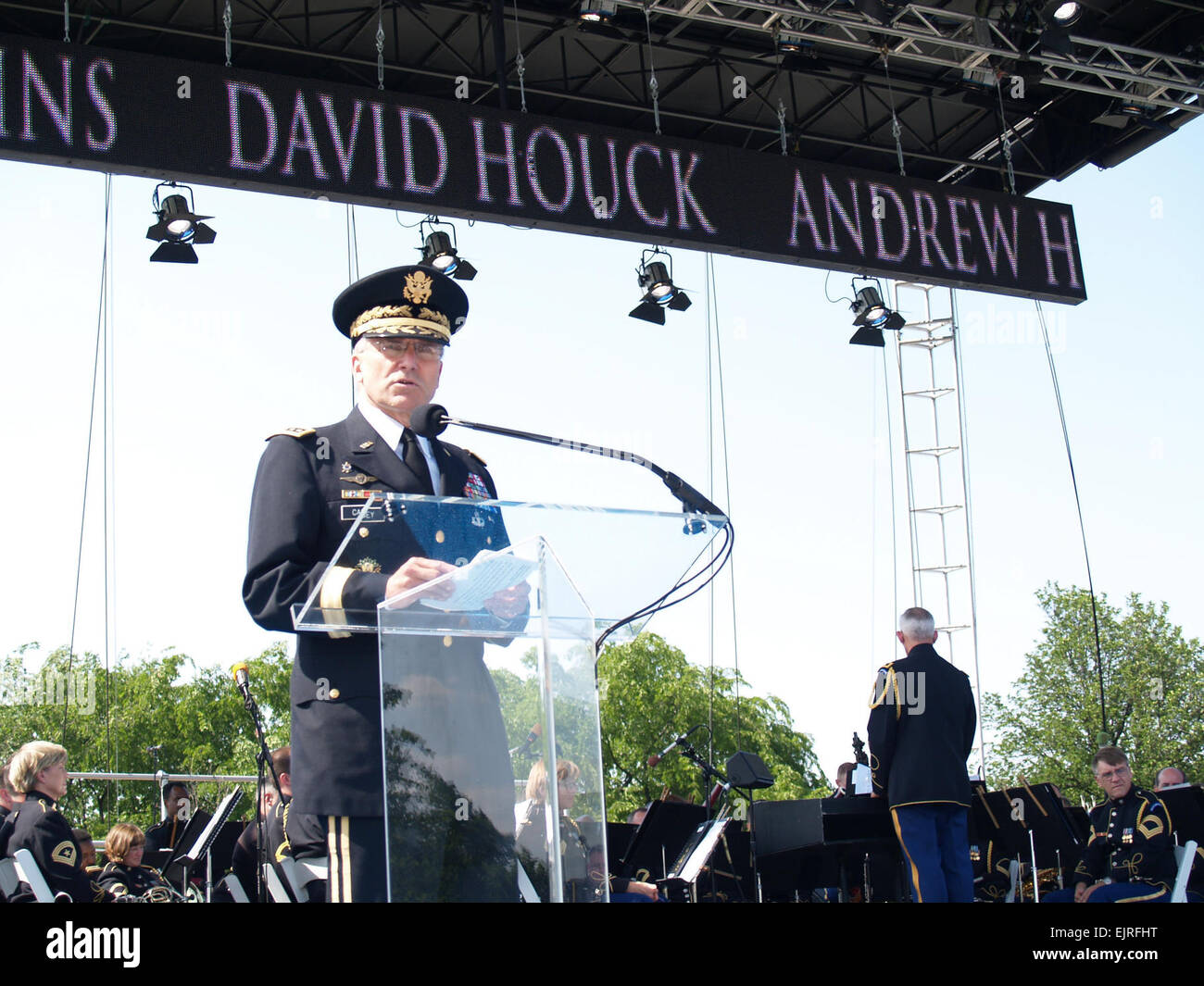 With the names of fallen soldiers scrolled above him, U.S. Army Gen ...