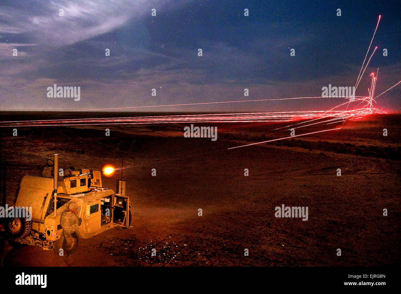 Soldiers fire .50-caliber machine gun rounds at the base of a training ...