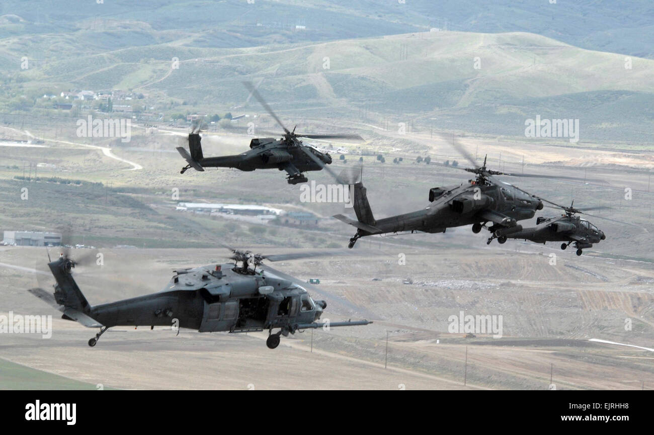 An Air Force HH-60 Pave Hawk helicopter, lower left, from Nellis Air ...
