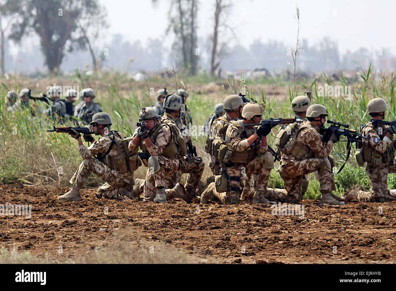 Karkh Area Command Strike Team soldiers, foreground, pull security ...
