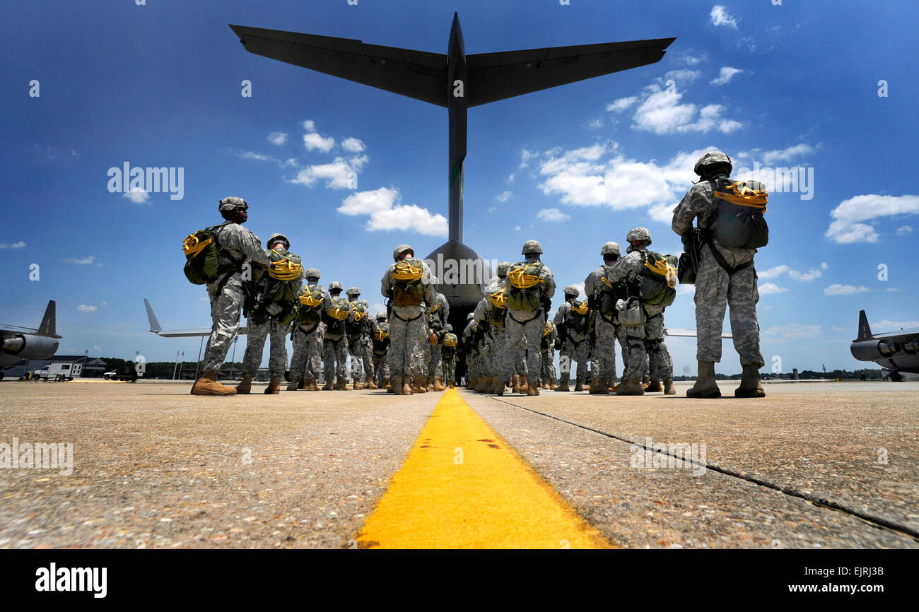 U.S. Soldiers wait to board a C-17 Globemaster III cargo aircraft based ...