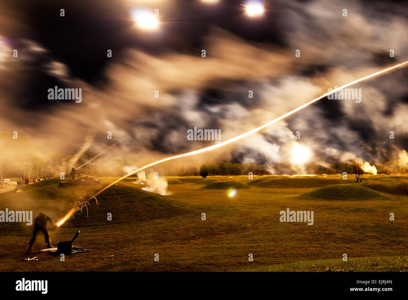 Flares and artillery simulators light up the sky during the M4 Rifle ...