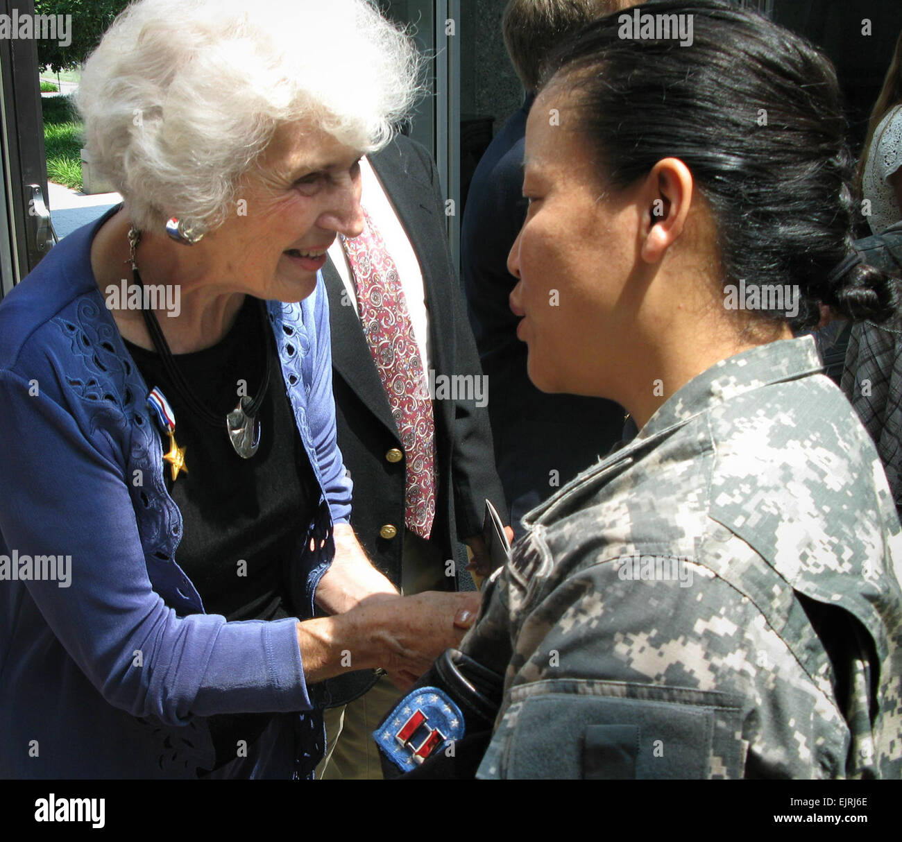 Mary Jane Bolles Reed talks with Army Capt. Rachel Park, the assistant ...