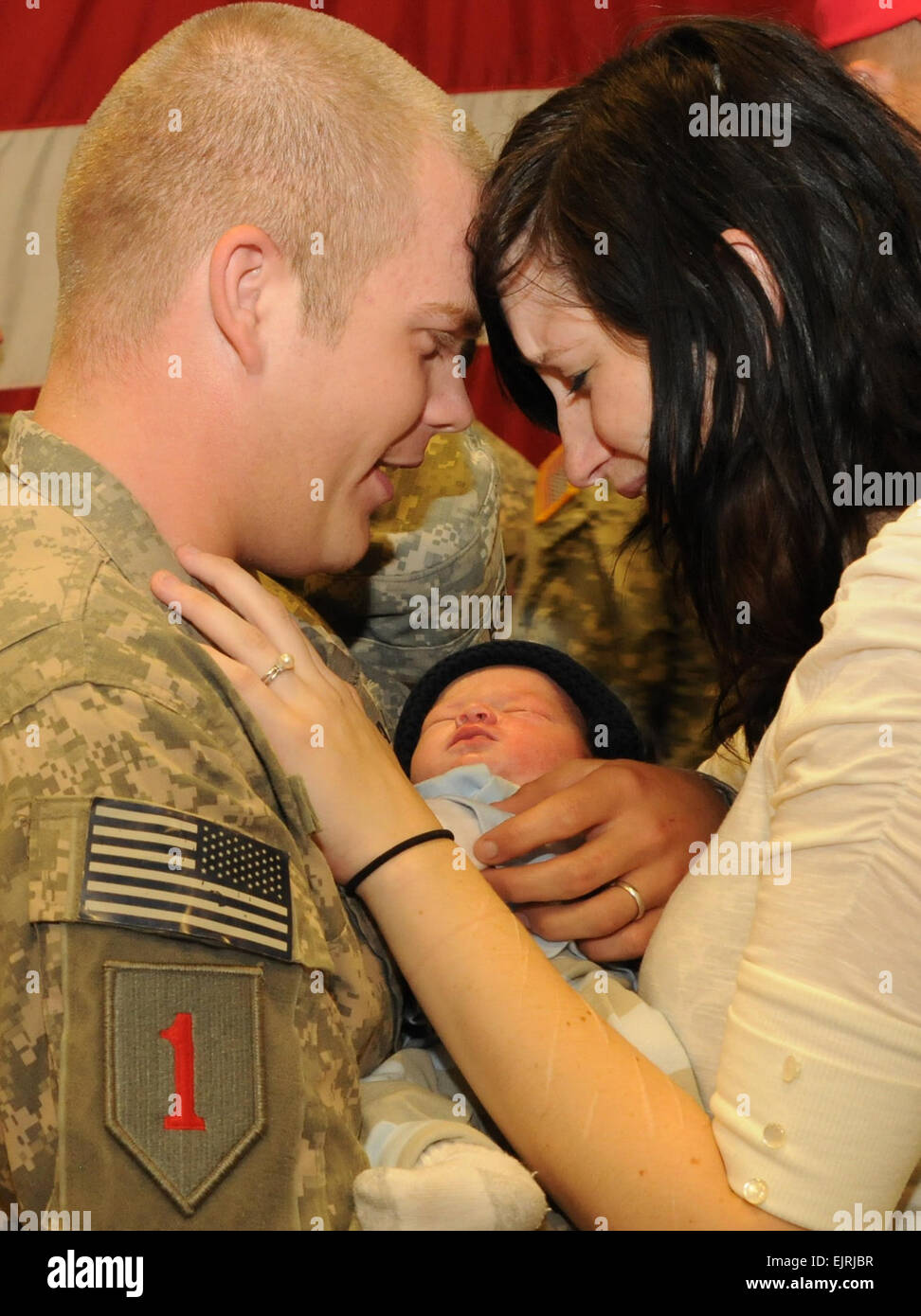 Pfc. Jordan Boswell and his wife Tifany hold their 9-day-old son Conner ...
