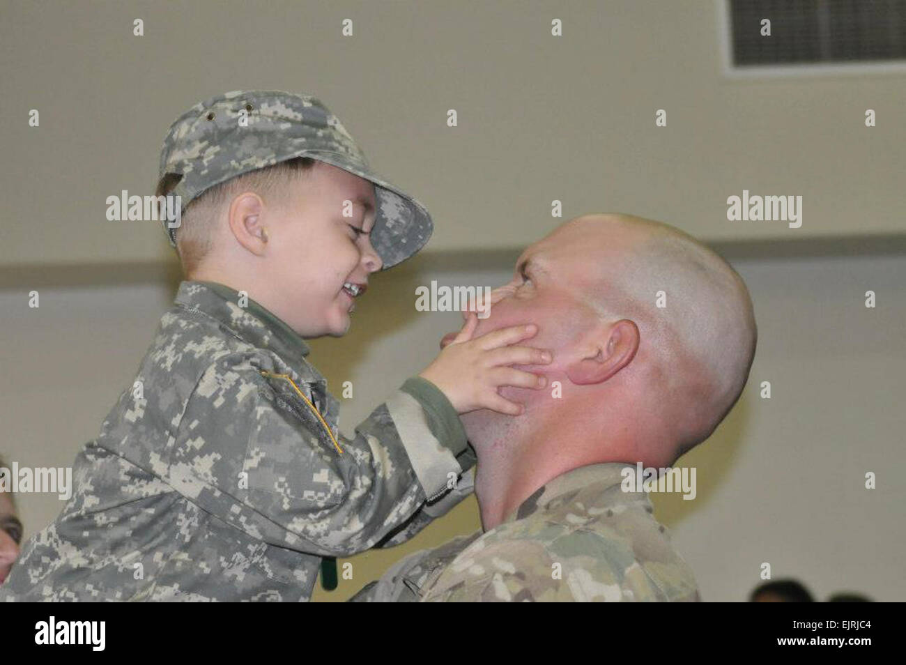 Four-year-old Malachi Ware scrunches his father's face at a welcome ...