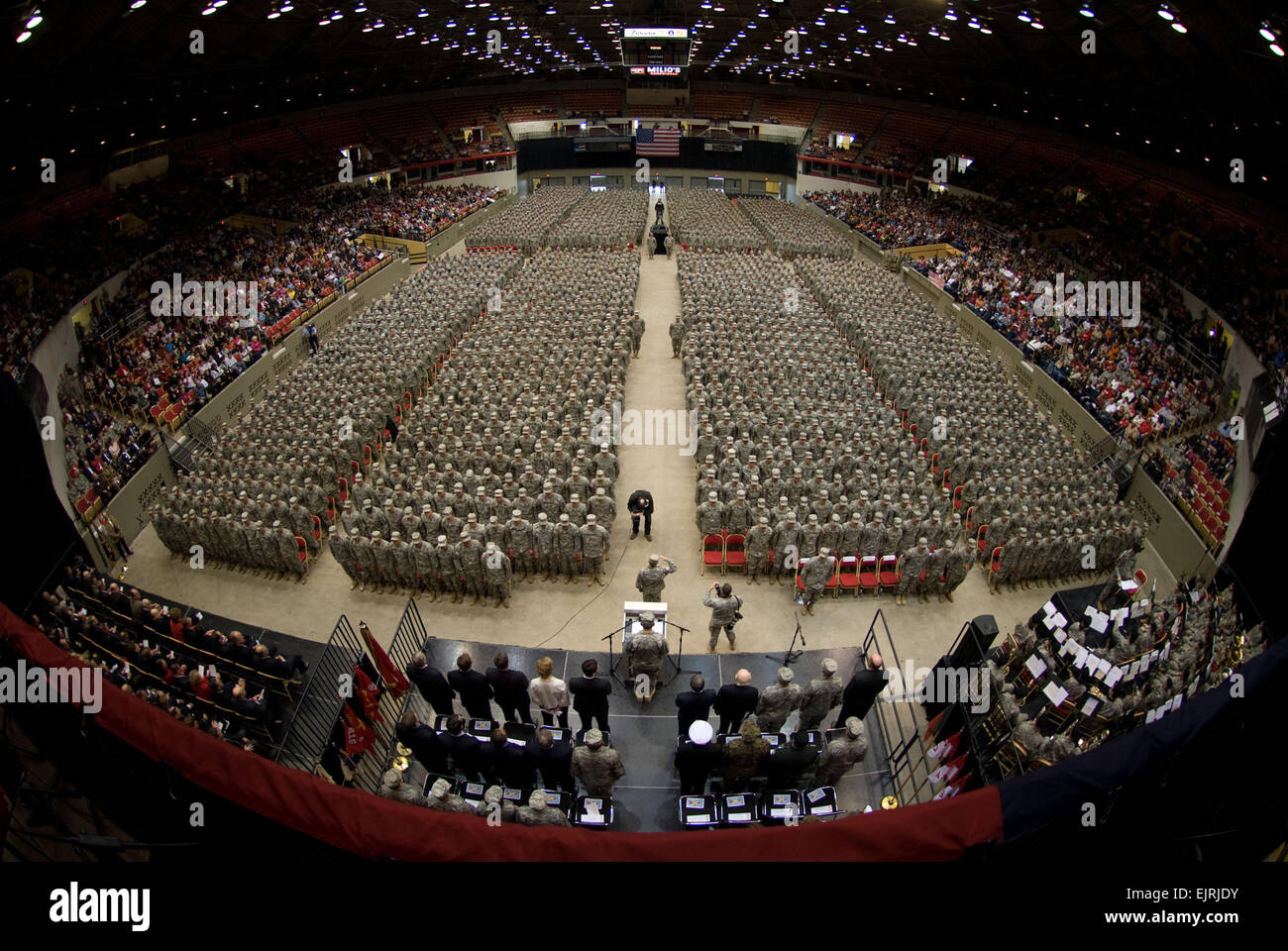 32nd Brigade Command Sgt. Maj. Ed Hansen, on floor in front of podium ...