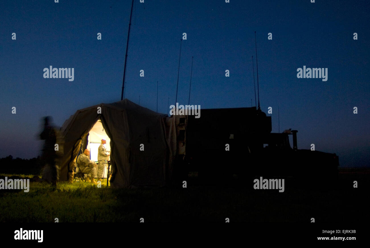 U.S. Soldiers man a forward node communications station during a live ...