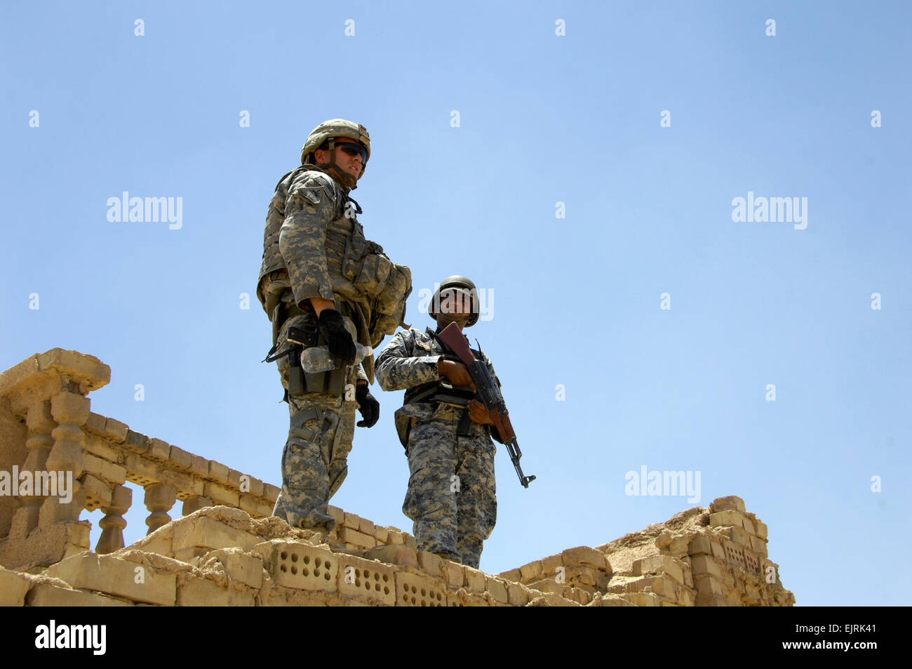 U.S. Army 1st Lt. Foster Thorpe, left, and an Iraqi National Police ...