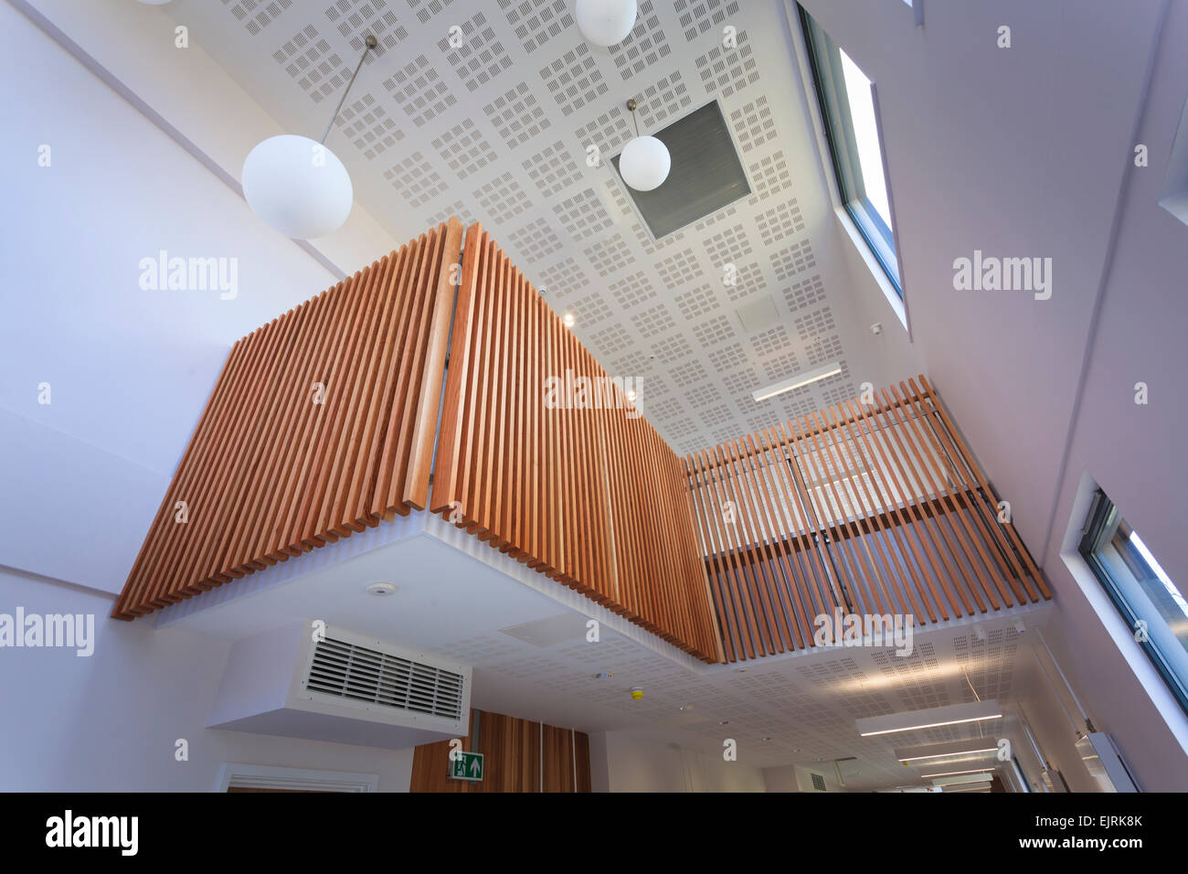 Timber balcony above main communal area of modern college building ...
