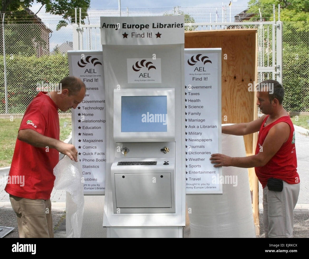 Movers crate an Army Europe Libraries e-Branch kiosk for shipment to ...