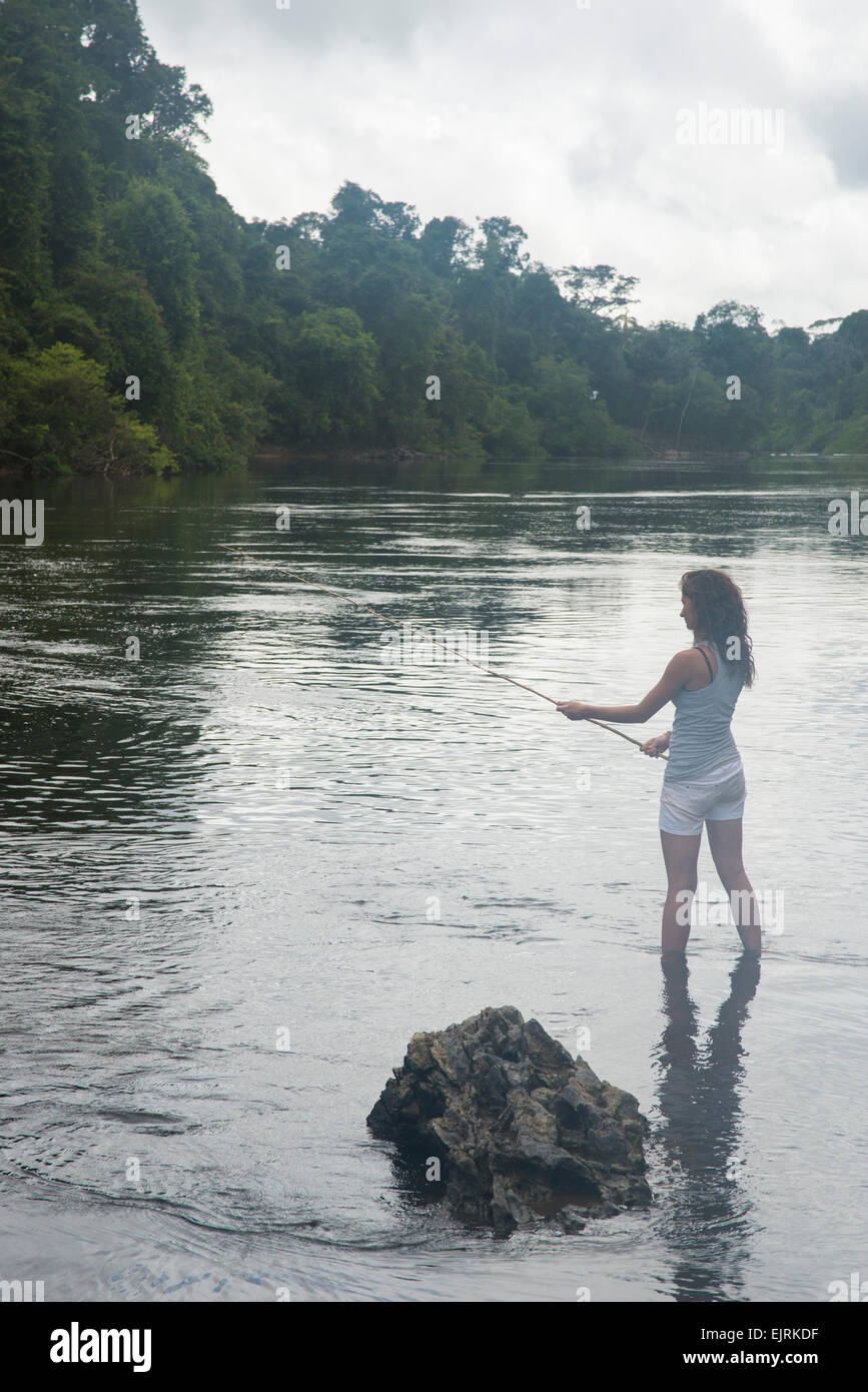 Fishing in the upper Coppename River, Central Suriname Nature Reserve ...