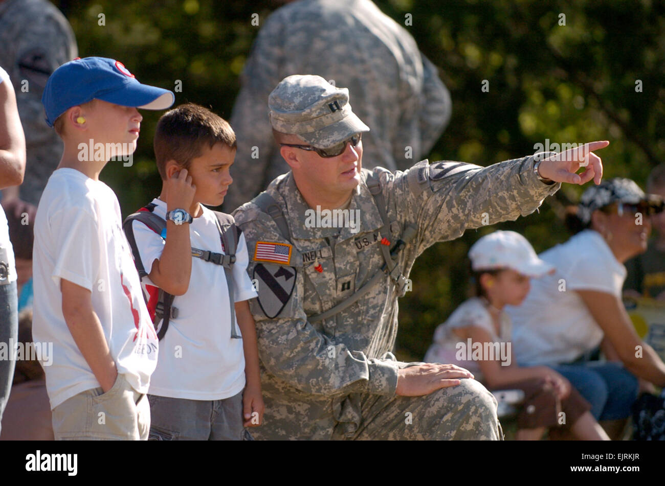 Capt. Tyler Donnel, Battery B commander, points out the Paladin to 9 ...