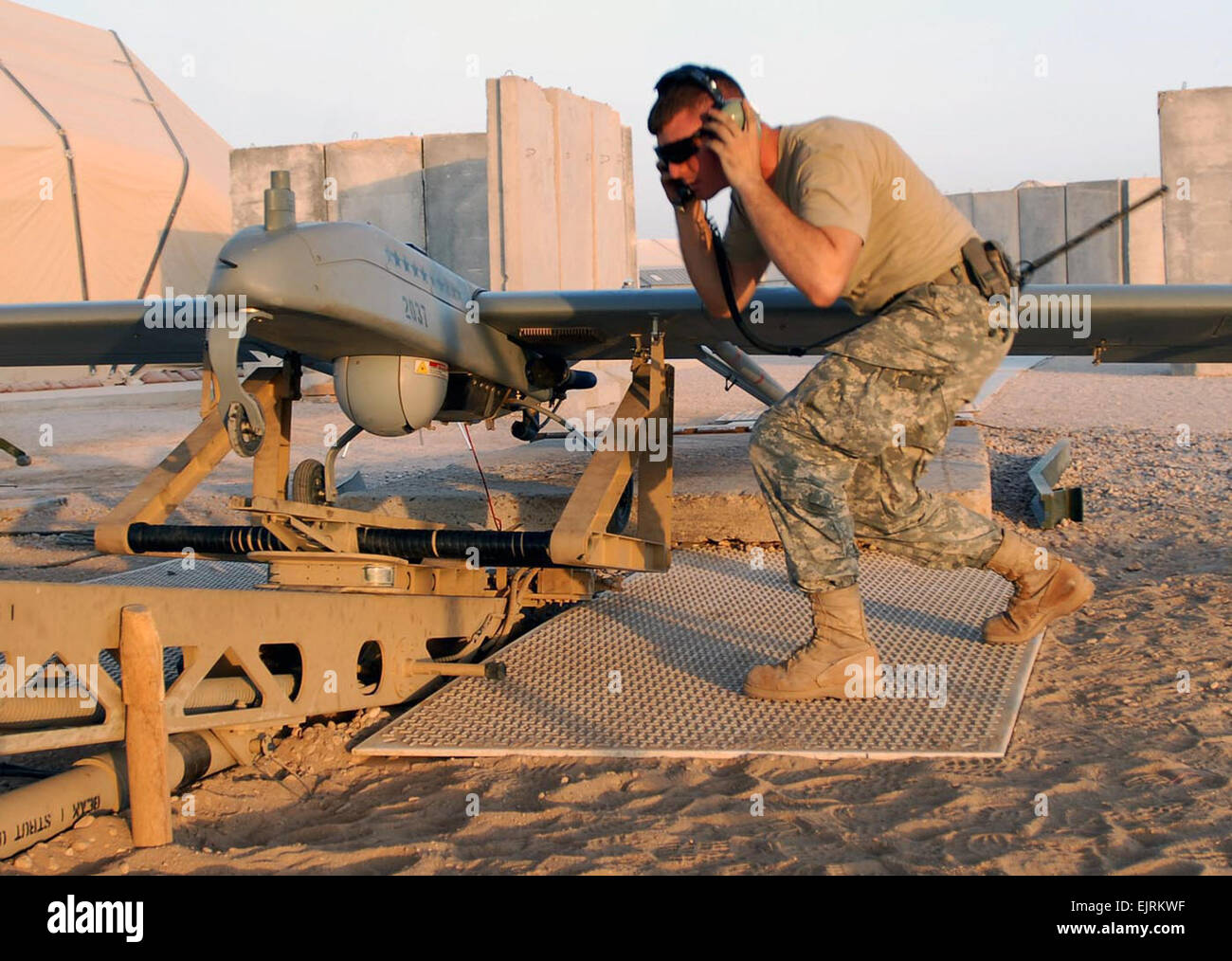 Sgt. Dustin Scott, unmanned aerial system maintainer, prepares a Shadow ...