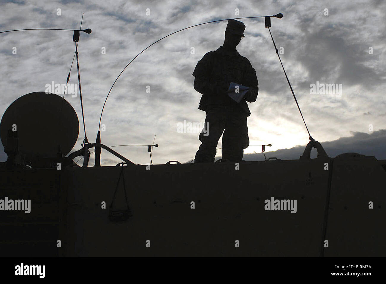 Spc. Michael Stutz inspects the top exterior of his newly assigned M ...