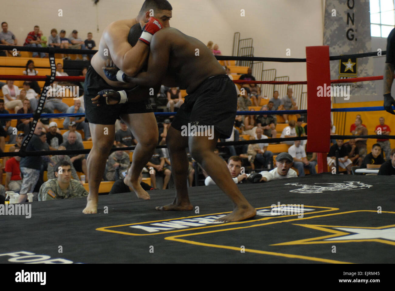 Staff Sgt. Brandon Sayles holds on to Staff Sgt. Benzell Vereen's head ...