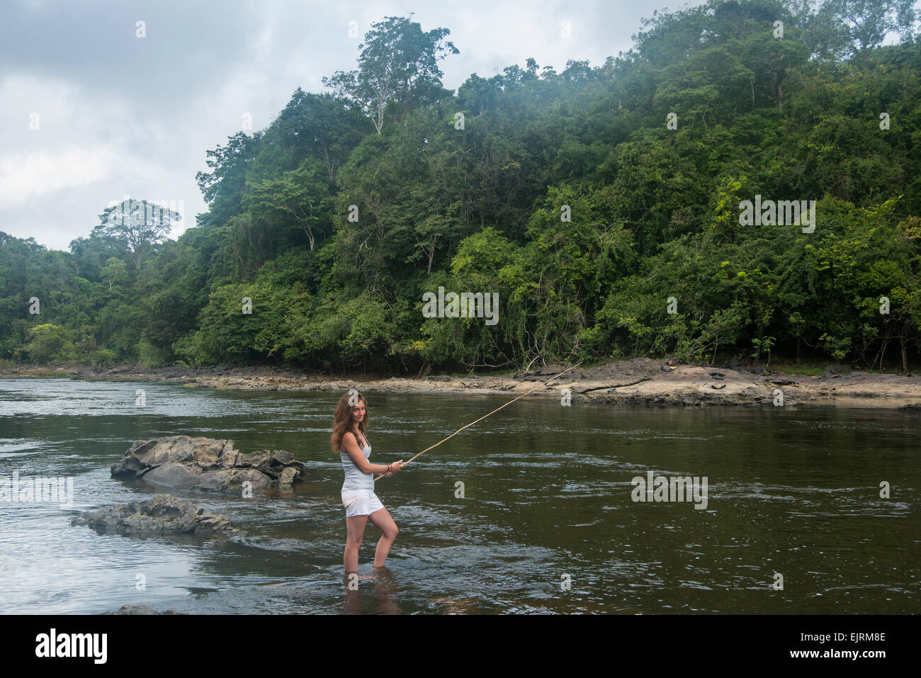 Fishing in the upper Coppename River, Central Suriname Nature Reserve ...
