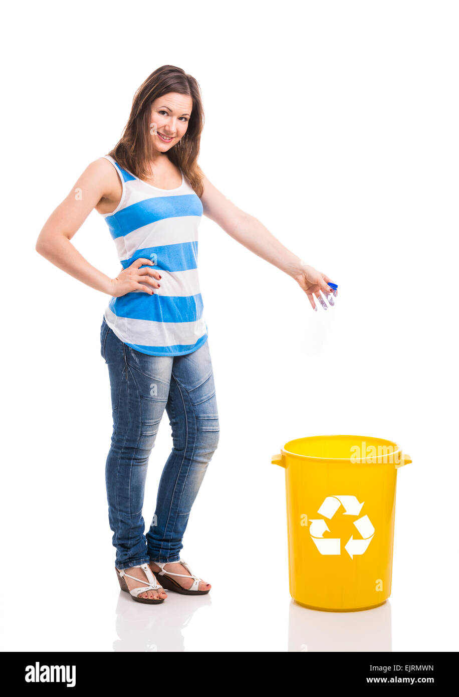 Beautiful young woman doing recycling, isolated over white background ...