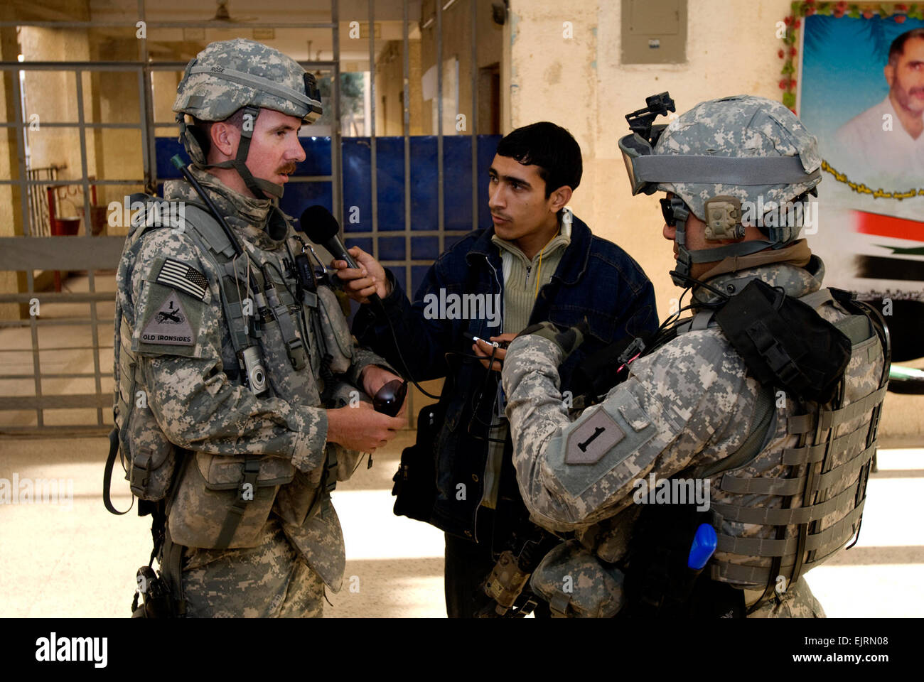 Capt. Jason Rose is interviewed about the humanitarian aid mission by a ...