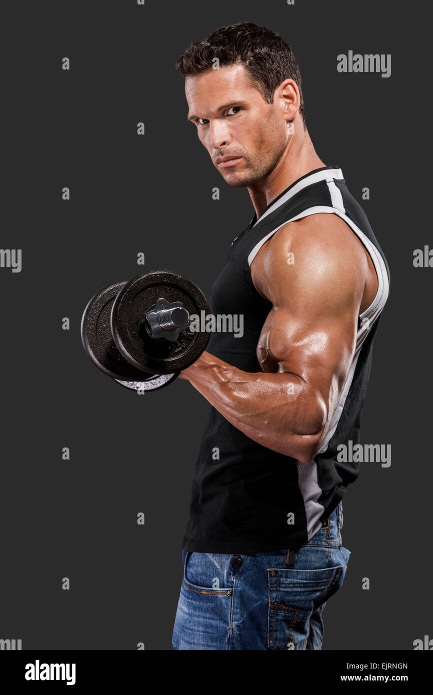 Muscle man lifting weights, isolated over a white background Stock ...