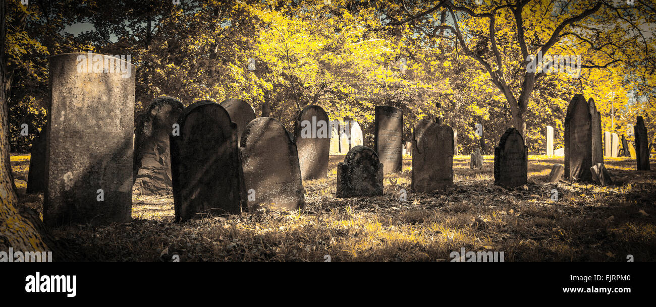 A panoramic view of a very old cemetery; photo done in seasonal ...