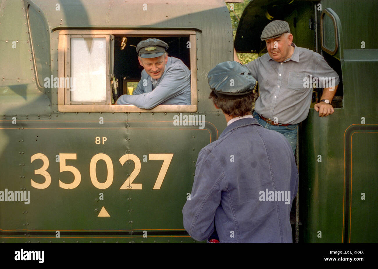 Steam train driving instructor Clive Groom (moustache) with trainees ...