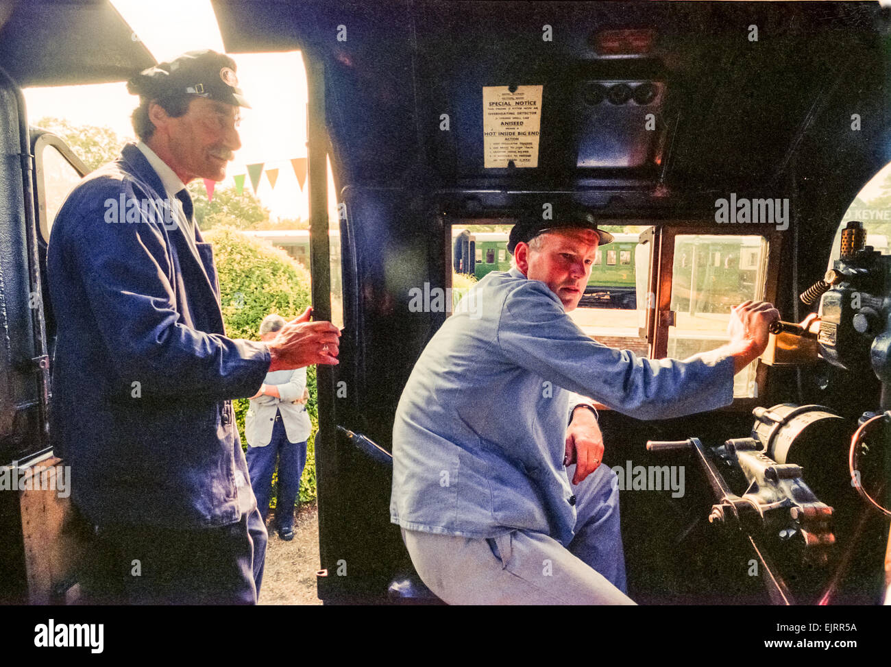 Steam train driving instructor Clive Groom (moustache) with trainees ...