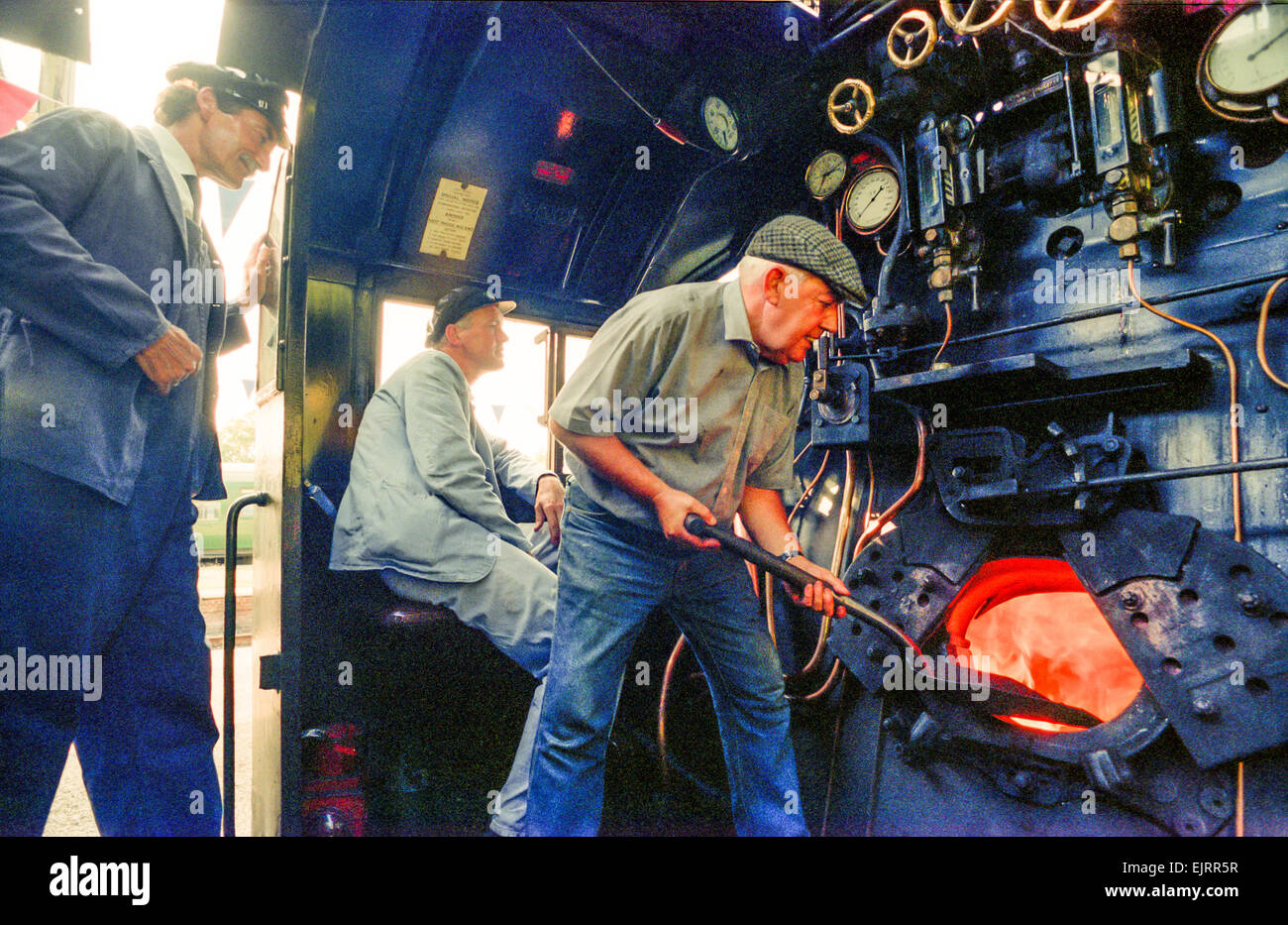 Steam train driving instructor Clive Groom (moustache) with trainees ...