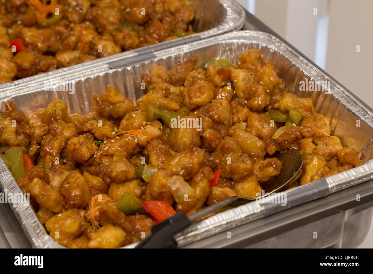 Closeup to Sweet and Sour Chicken at a buffet Stock Photo - Alamy