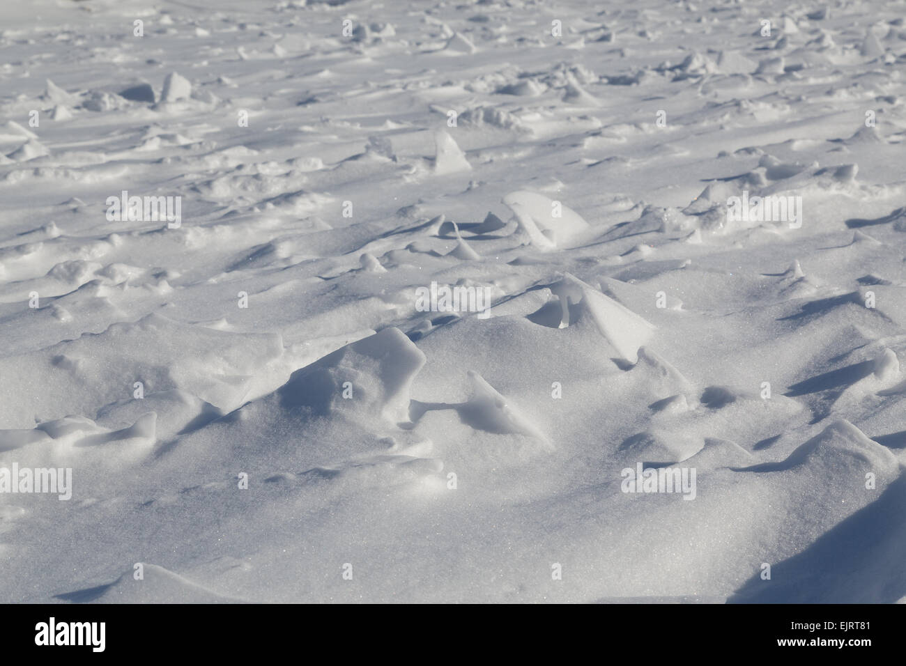 Full frame bumpy snow background Stock Photo - Alamy