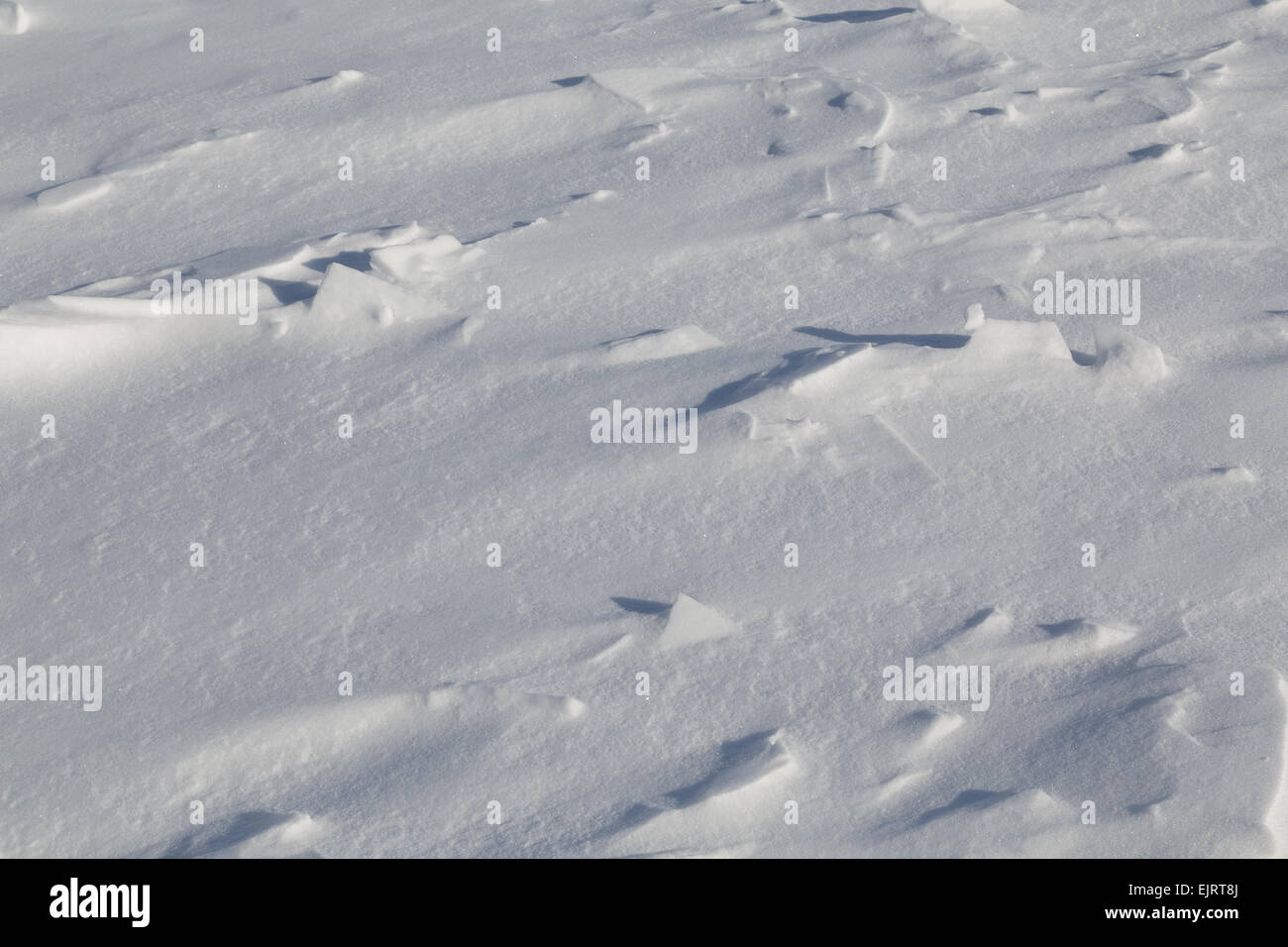 Full frame bumpy snow background Stock Photo - Alamy