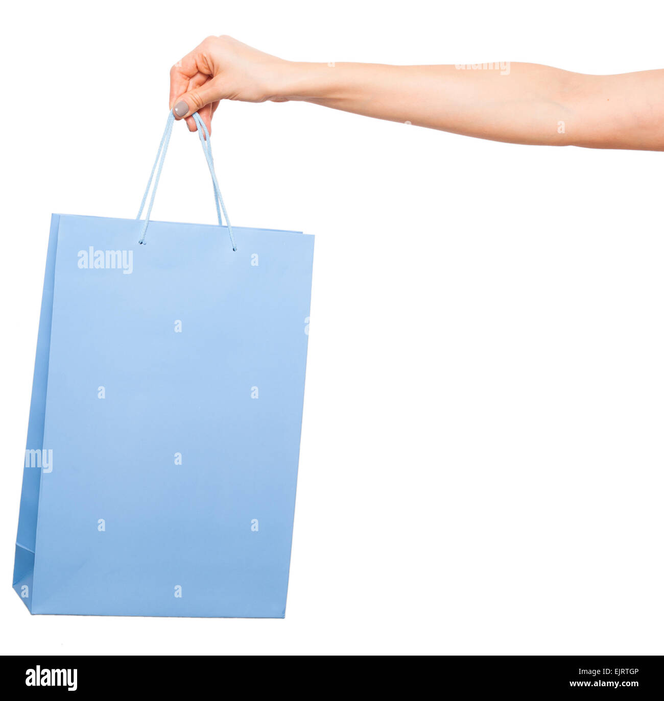 blue shoping bag signifying gift or shopping holded by a woman hand on ...